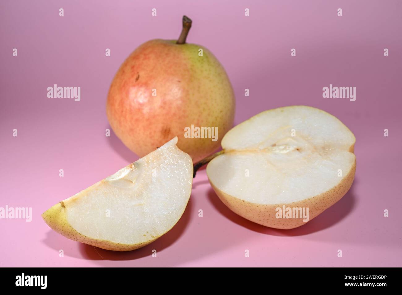 two juicy pears on a pink background studio shooting 6 Stock Photo - Alamy