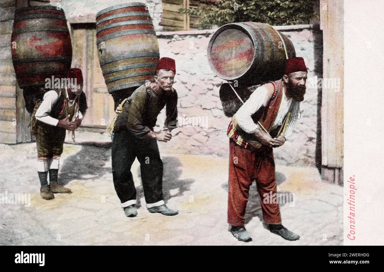 Men carrying barrels on back, Constantinople Turkey, approx 1910s ...