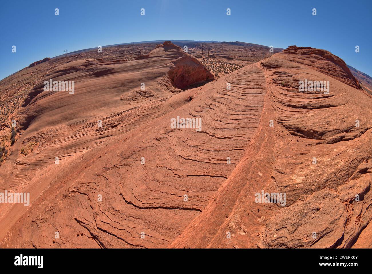 View from the top of a wavy sandstone mesa, which is a fossilized sand ...