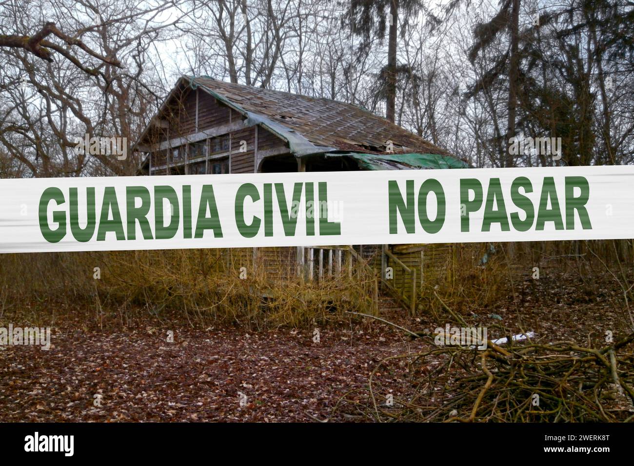 Abandoned cabin in the woods with a police tape with written in it in ...