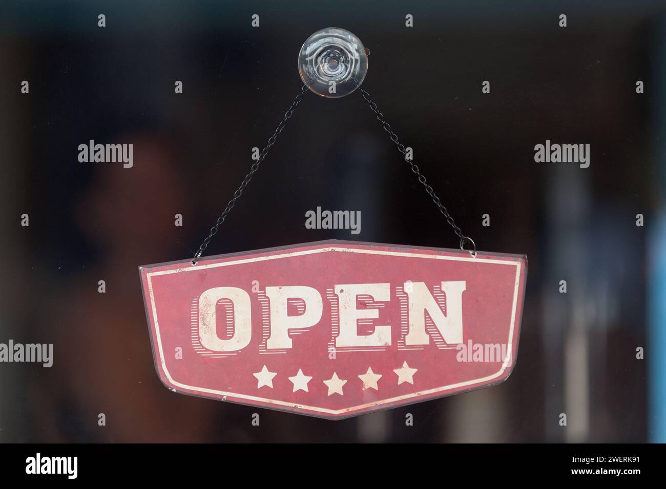 Old fashioned sign in the window of a shop saying in "Open Stock Photo ...