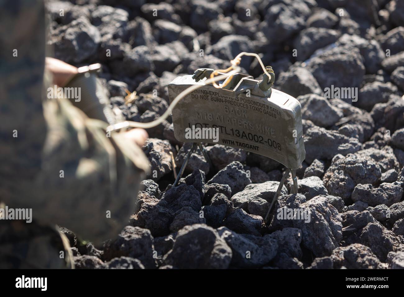 An M18 claymore mine is prepared for a demolition range during exercise ...