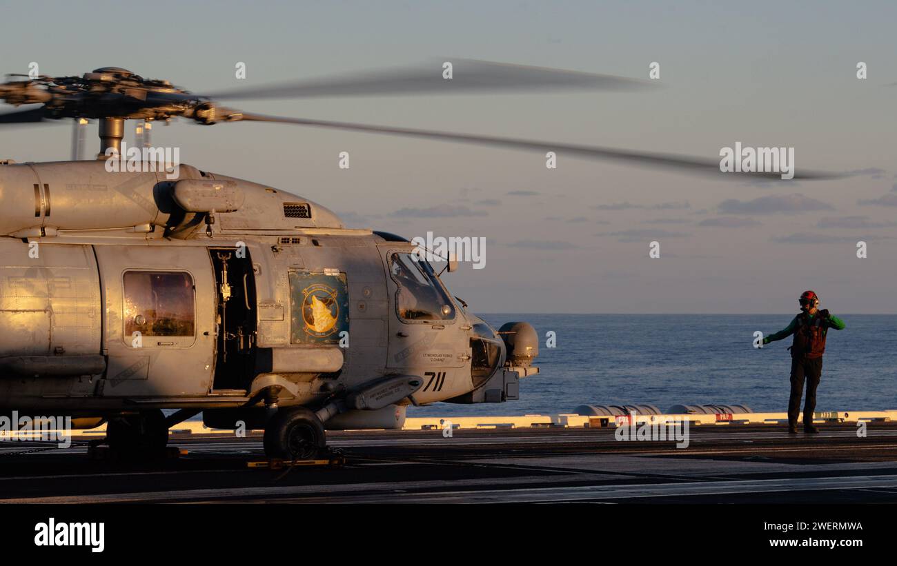 PACIFIC OCEAN (Jan. 24, 2024) An MH-60R Sea Hawk, attached to the “Wolf ...