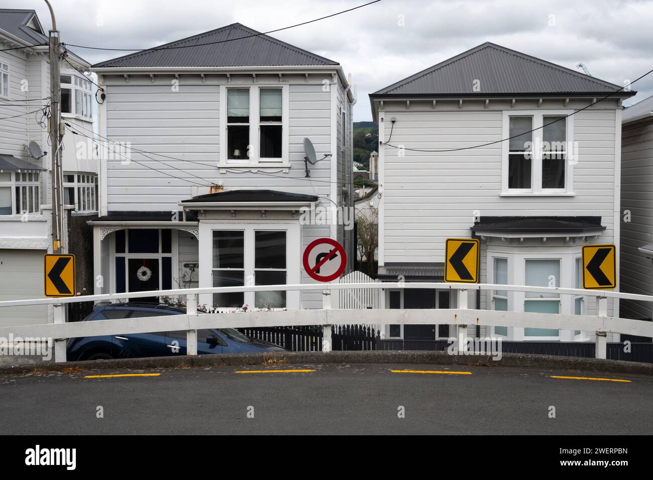 Road signs in front of old wooden houses, Mount Victoria, Wellington ...