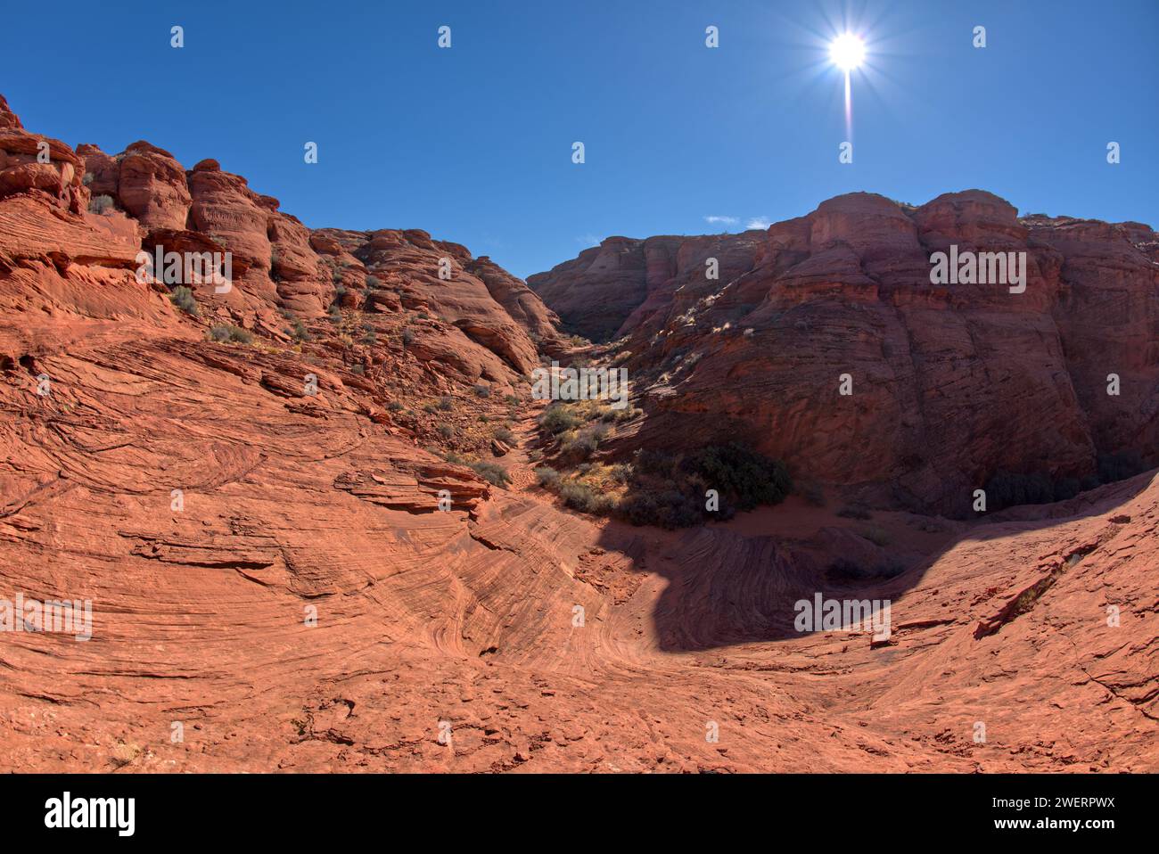A dry waterfall of wavy sandstone in the spur canyon just north of the ...