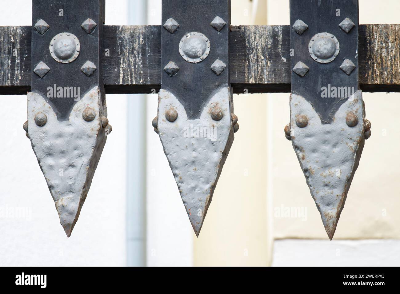 wooden portcullis with spiked metal caps at a medieval gate castle in ...