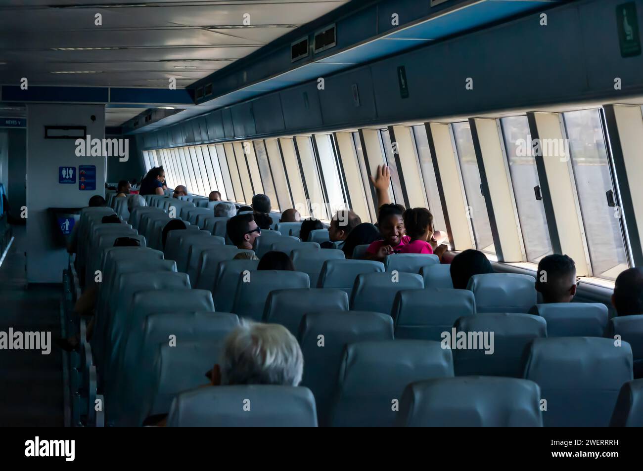 Passengers relaxing and enjoying the travel on Guanabara bay waters ...