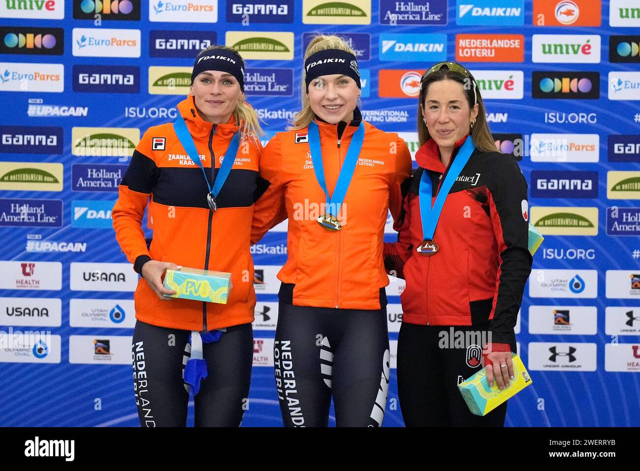 First-place finishier Joy Beune, center, celebrates on the podium with ...