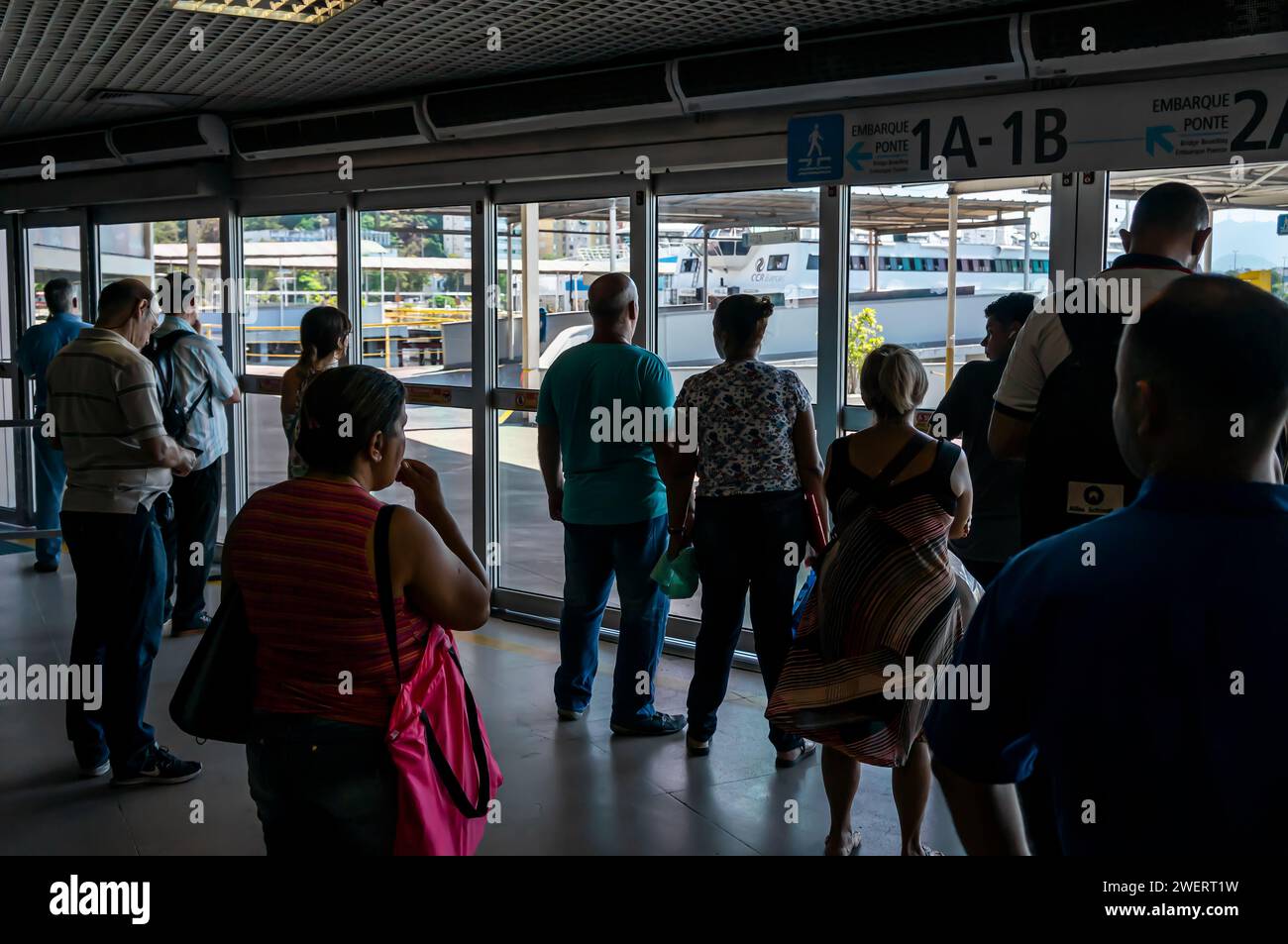 Passengers awaiting clearance to aboard the ferry boat inside Arariboia ...