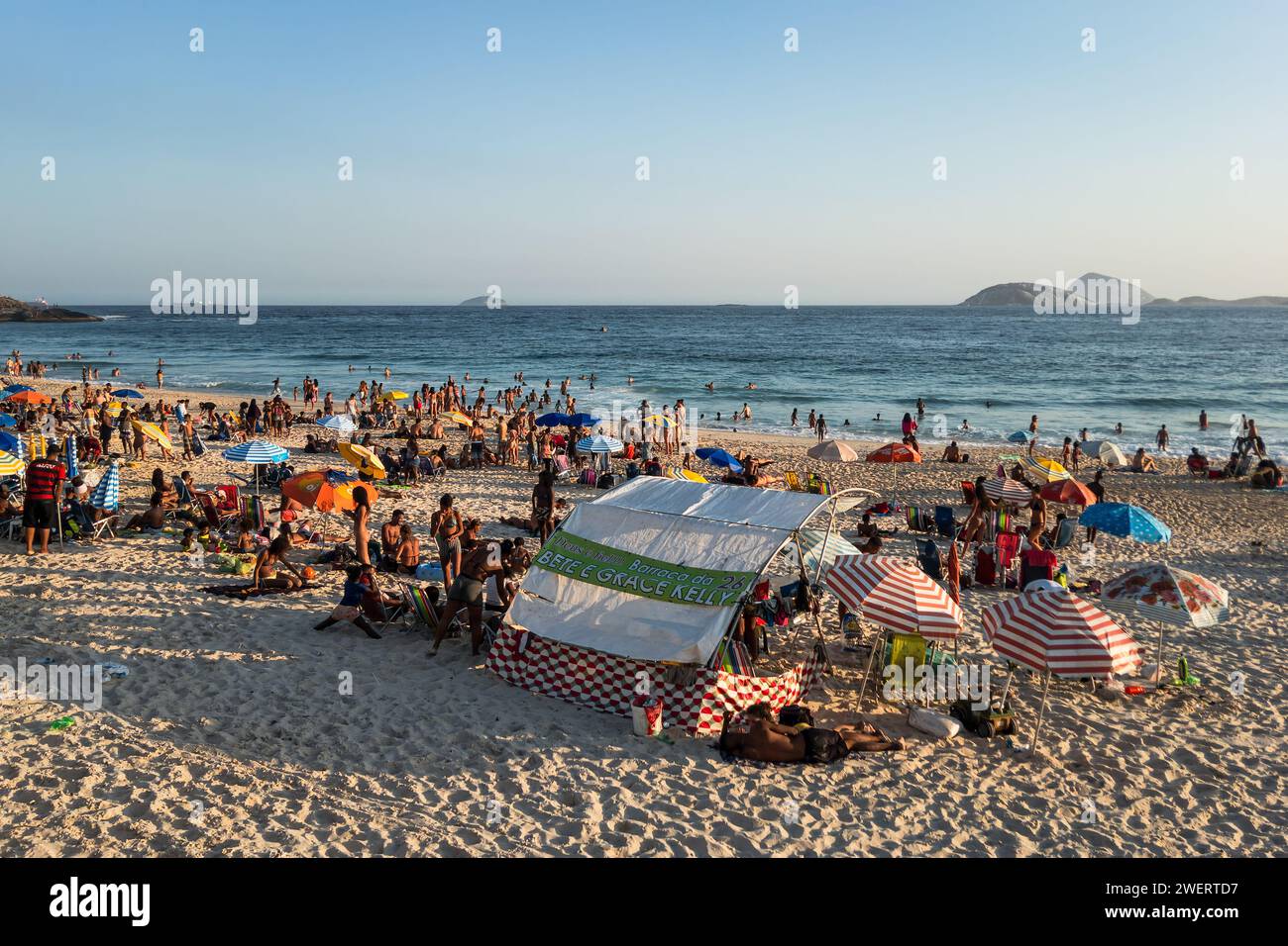 People enjoying some time on the heavily crowded Arpoador beach at ...