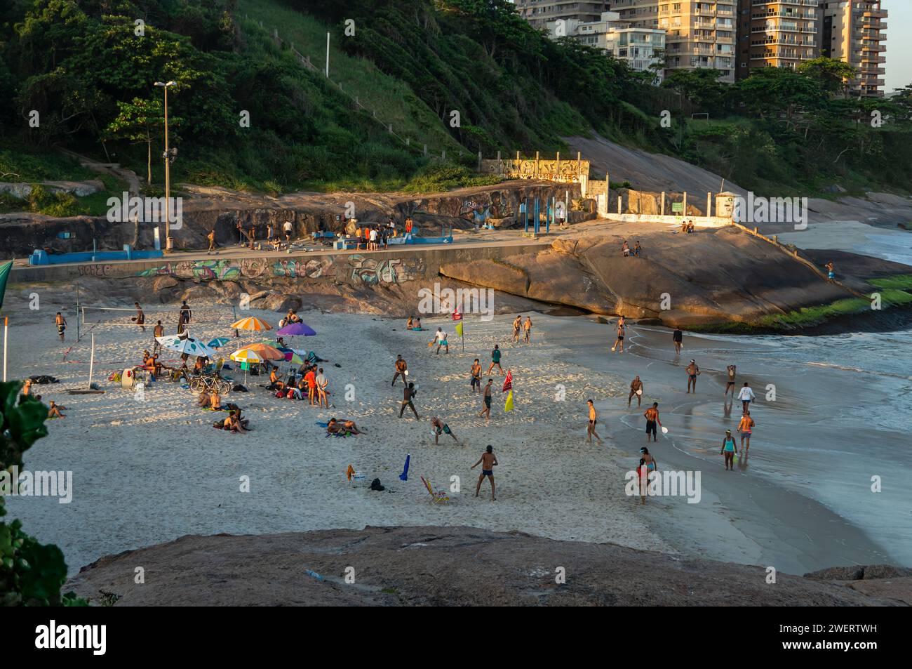 People playing sports and enjoying some time on the small Praia do ...