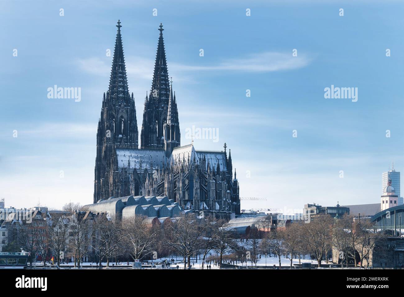 snowy city view with the cologne cathedral on a cold january day in ...