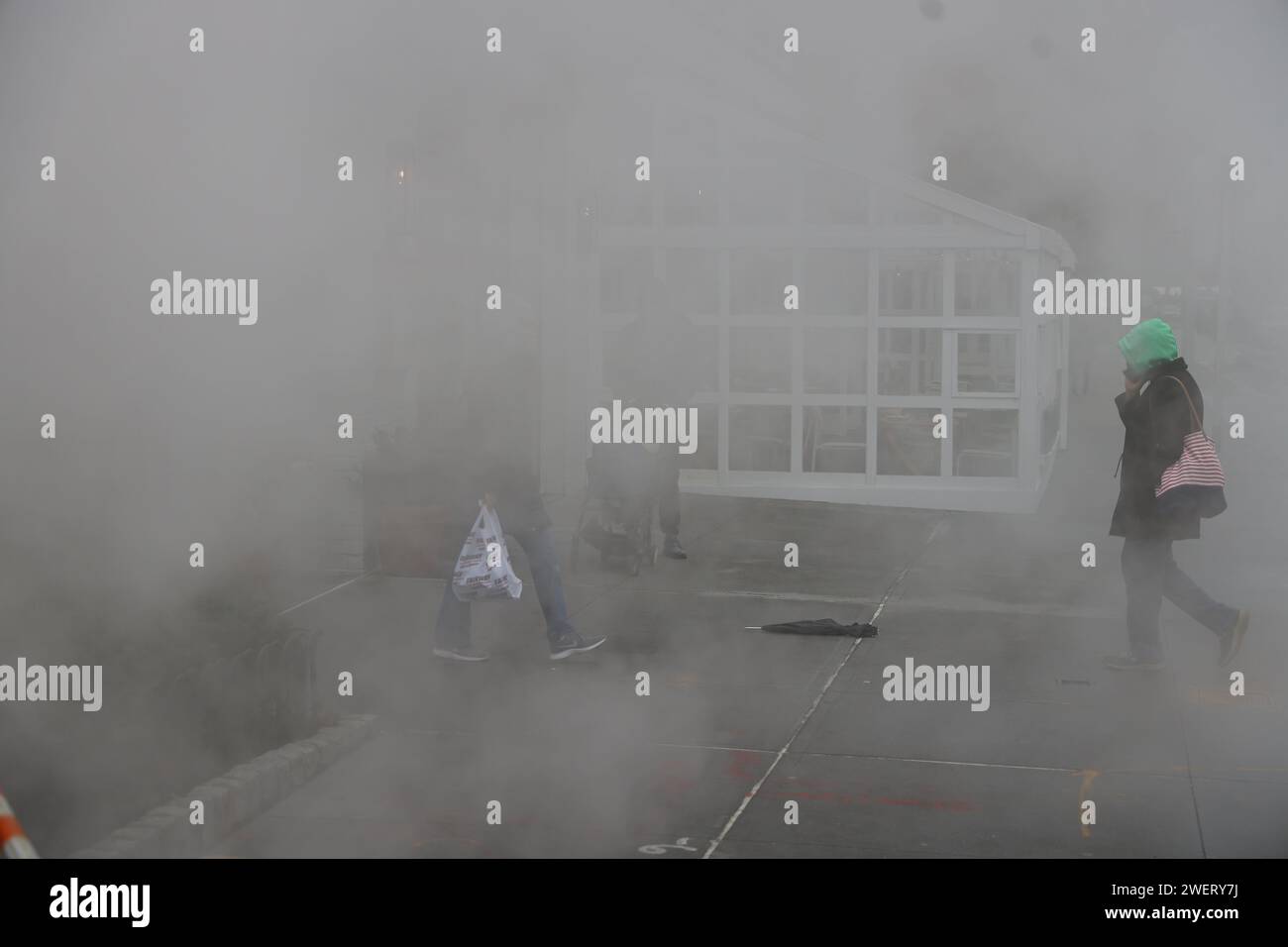 A view of Con Ed steam man hole sweeps through the air on First Avenue ...