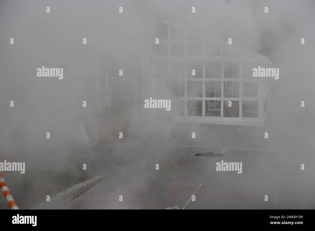 A view of Con Ed steam man hole sweeps through the air on First Avenue ...