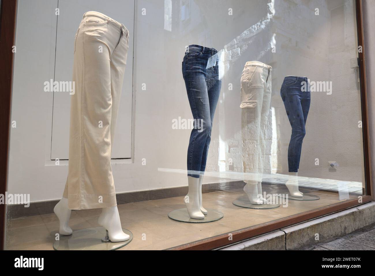 Shop display with mannequins in stylish pants Stock Photo - Alamy