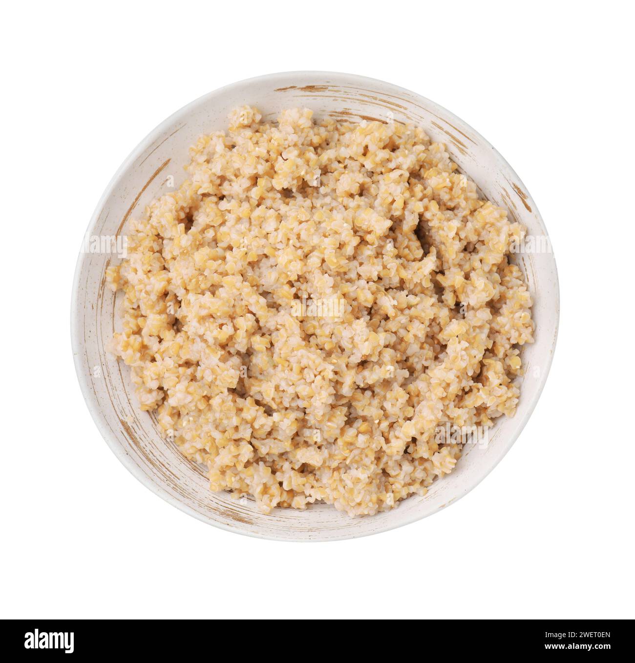 Tasty wheat porridge in bowl isolated on white, top view Stock Photo ...