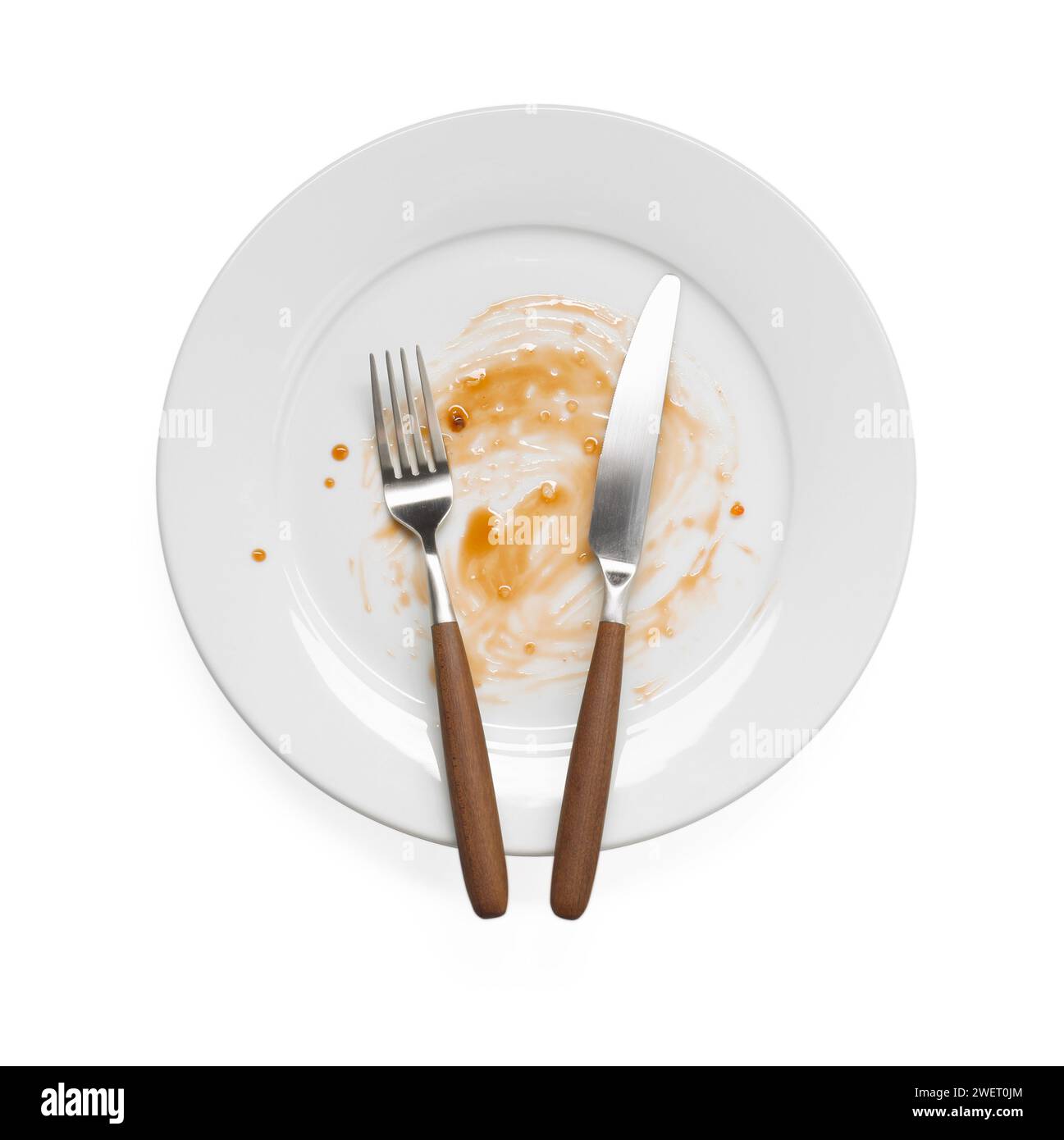 Dirty plate and cutlery on white background, top view Stock Photo - Alamy