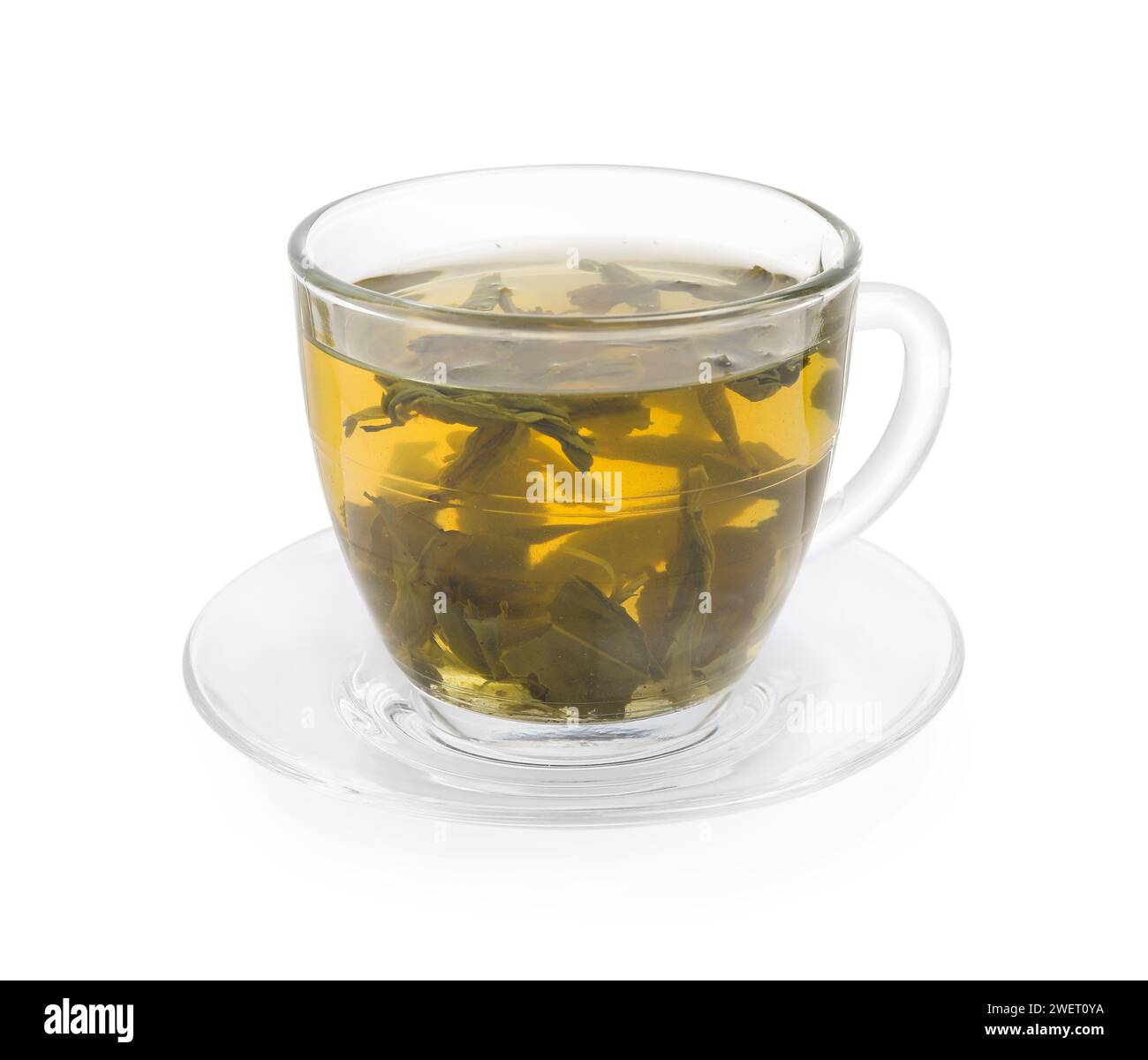 Fresh green tea in glass cup, leaves and saucer isolated on white Stock ...