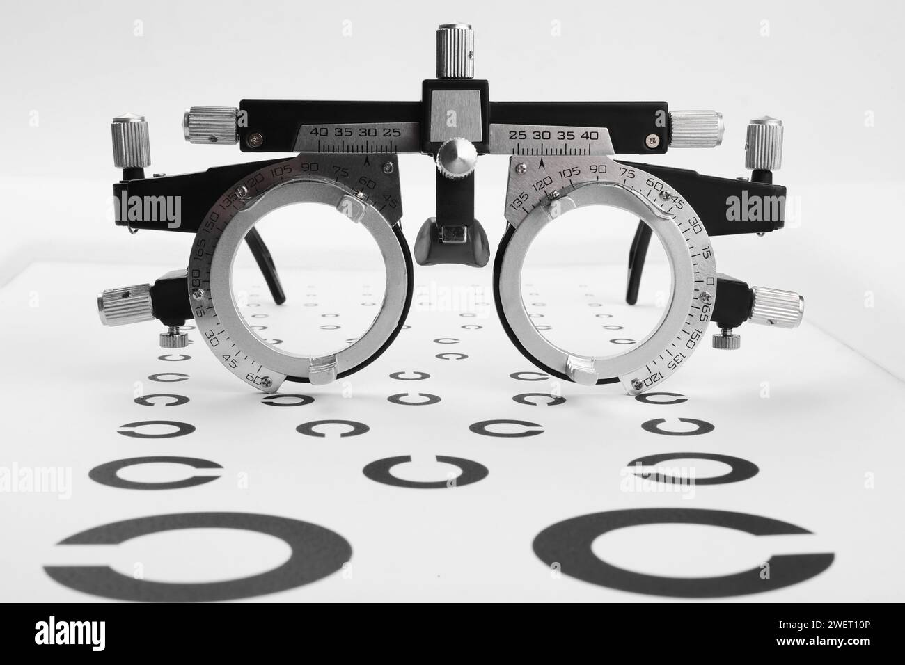 Trial frame and vision test chart isolated on white Stock Photo - Alamy