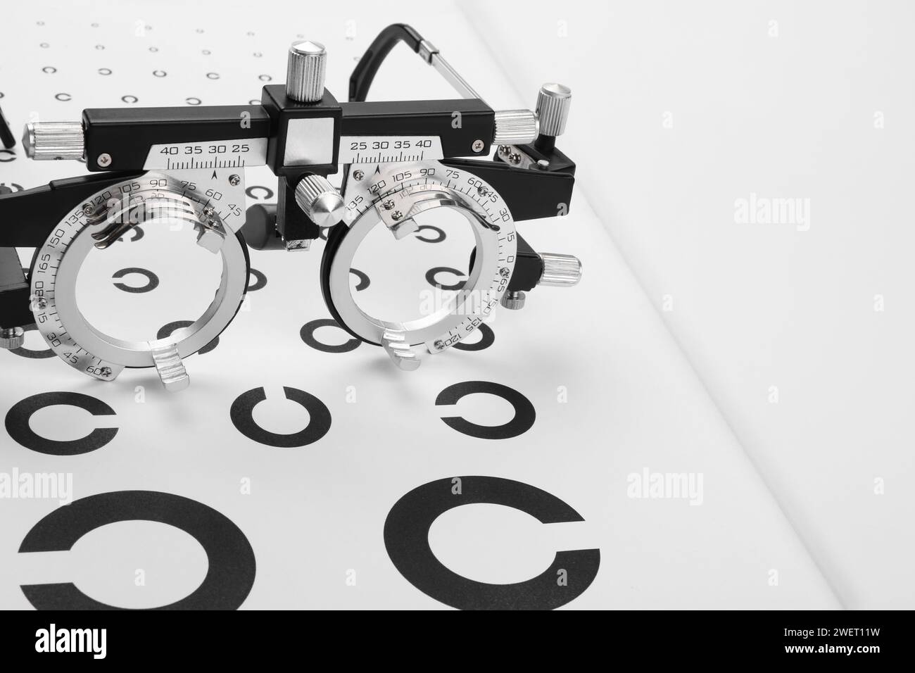 Trial frame and vision test chart isolated on white Stock Photo - Alamy