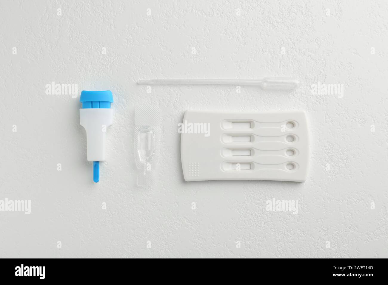 Disposable express test kit on white table, flat lay Stock Photo - Alamy