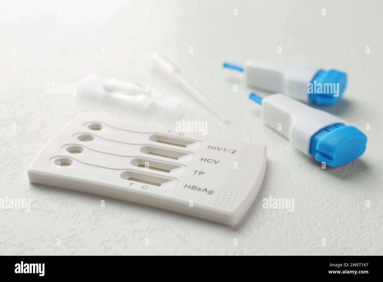 Disposable multi-infection express test kit on white table, closeup ...