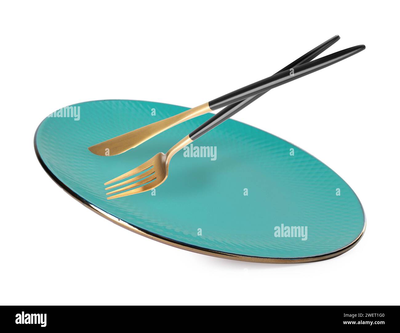 Clean plate, fork and knife falling on white background Stock Photo - Alamy
