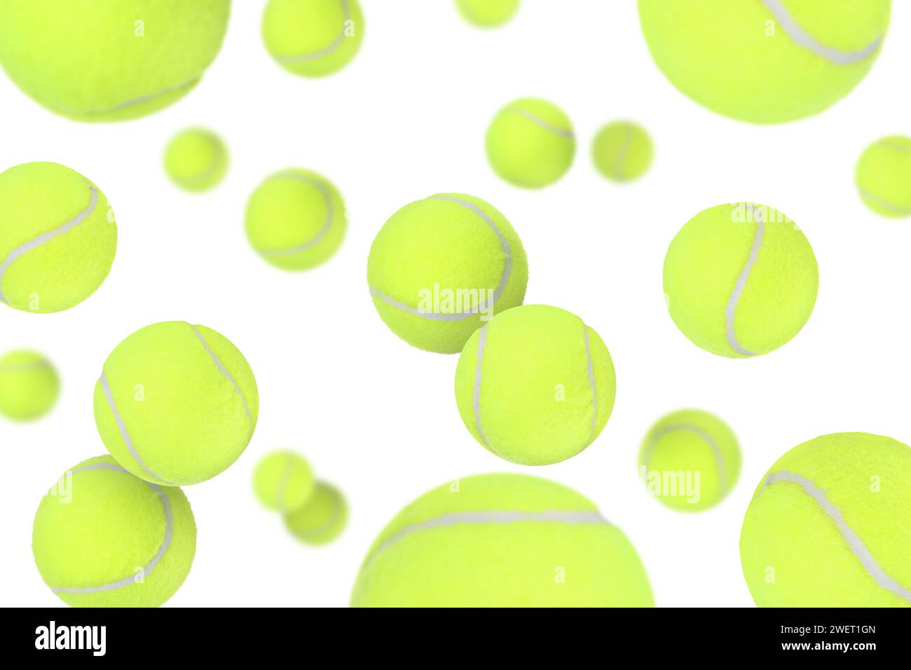 Many tennis balls falling on white background Stock Photo - Alamy