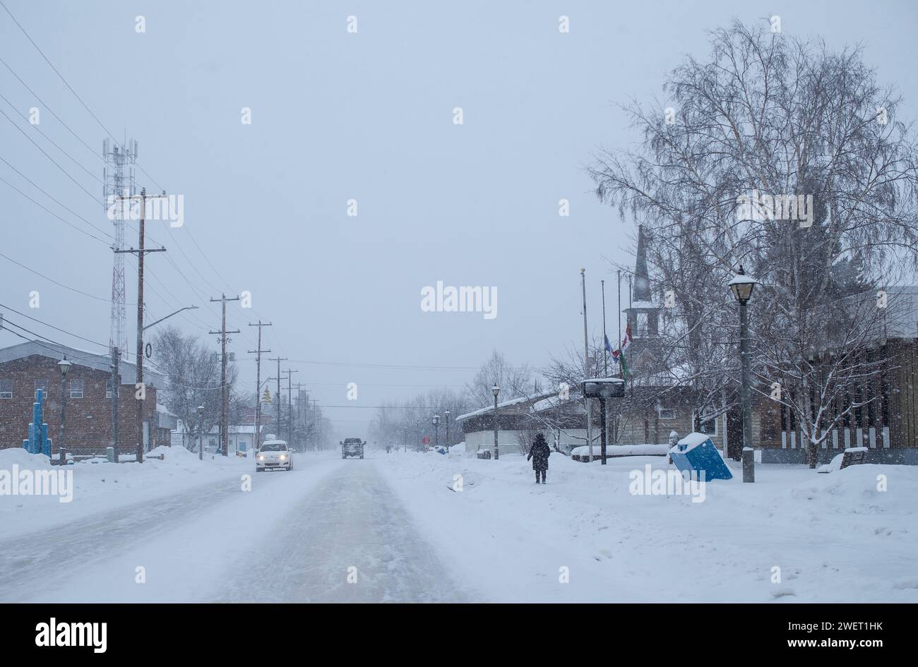 Fort Smith, Canada. 26th Jan, 2024. A pedestrian walks along the main ...