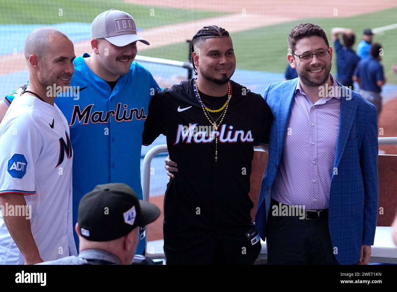Miami Marlins infielder Jake Burger, second from left, and first ...