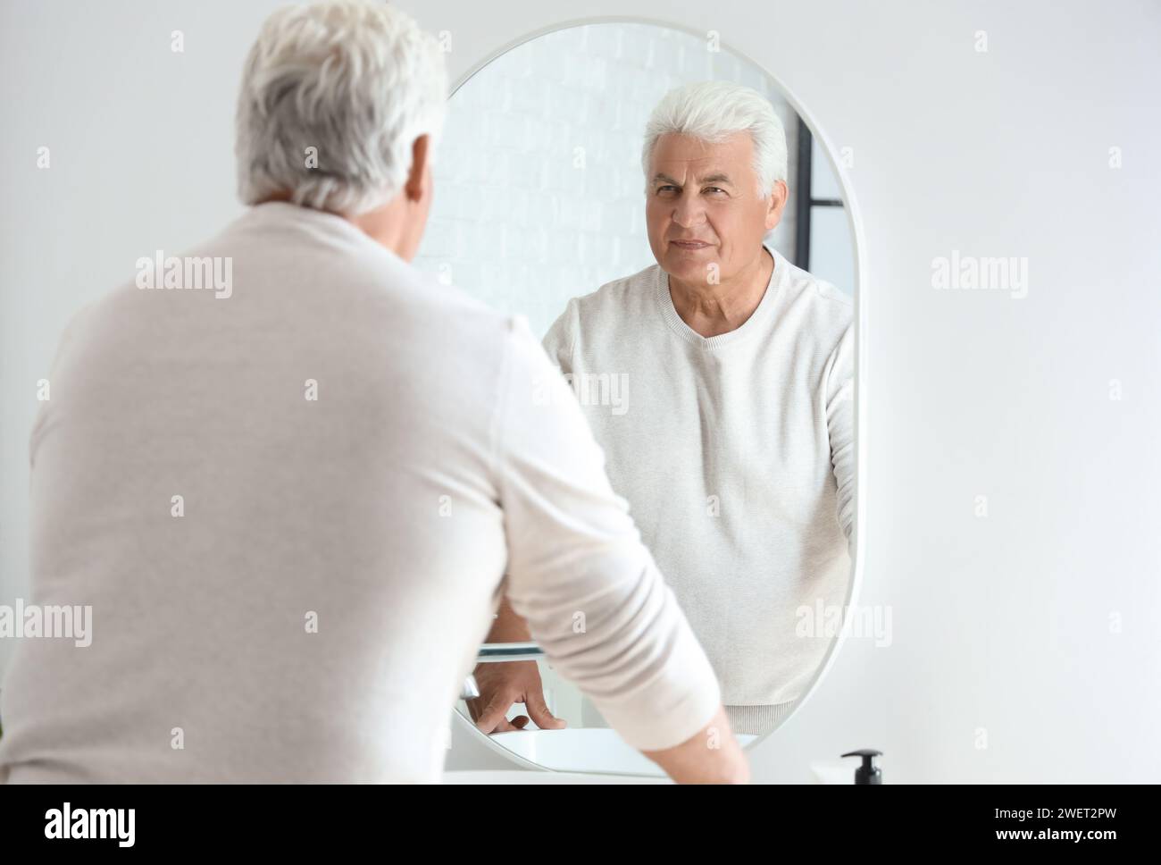 Elderly man back view mirror hi-res stock photography and images - Alamy
