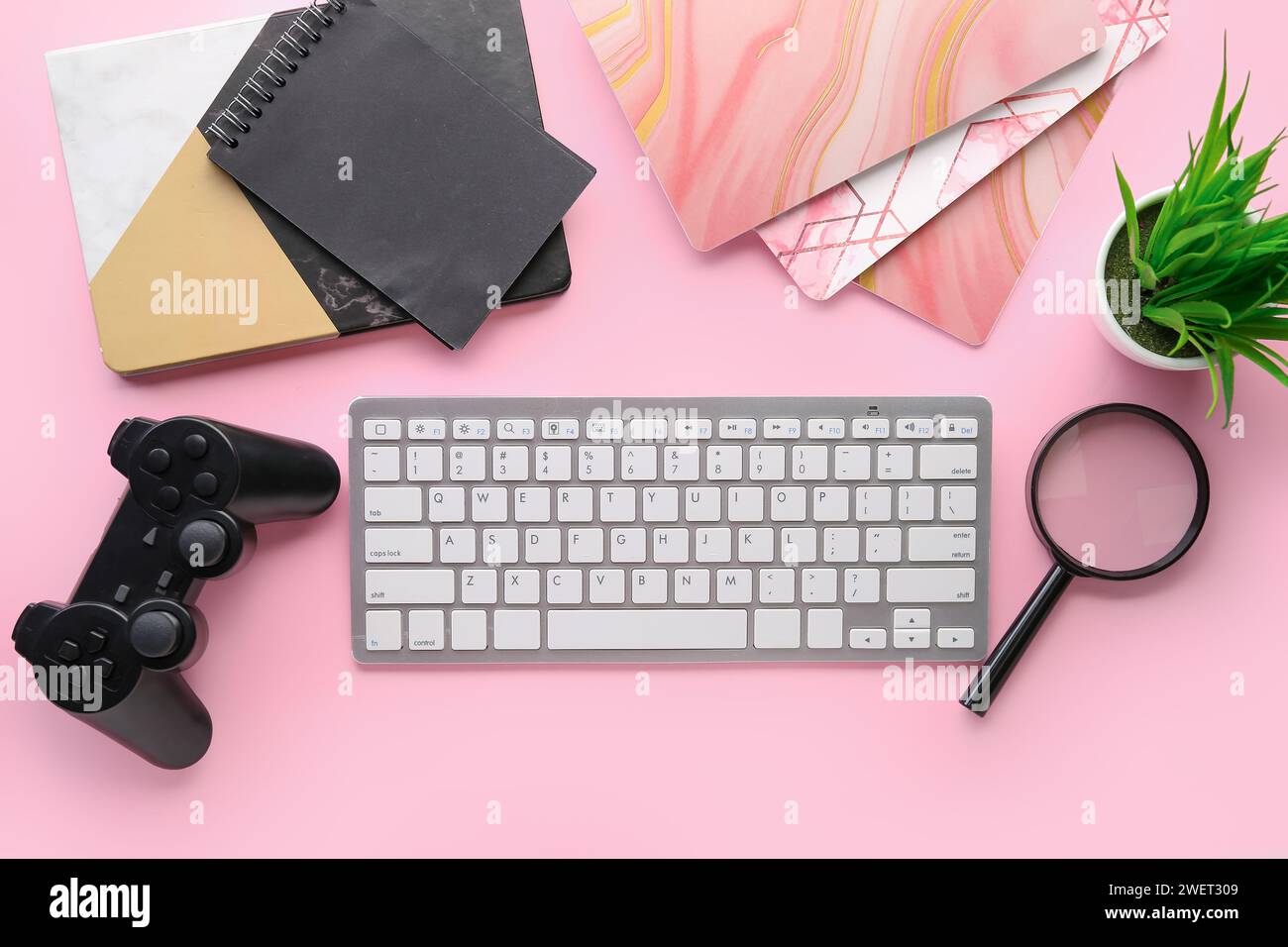 Composition with modern computer keyboard, joystick, magnifier ...