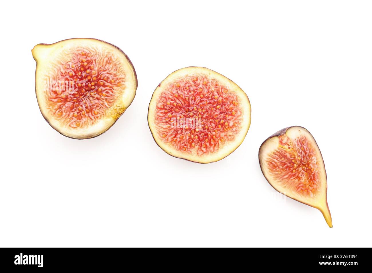 Cut fresh figs on white background Stock Photo - Alamy