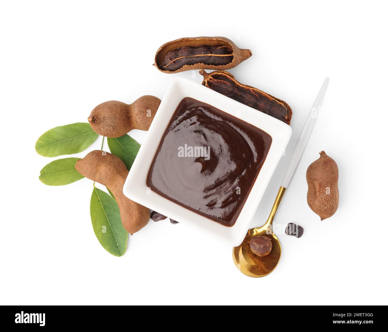 Bowl with tasty tamarind jam and fruits on white background Stock Photo ...