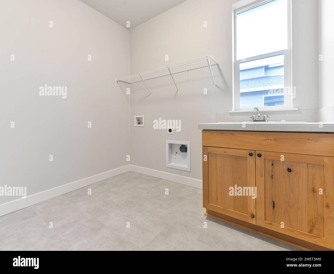 Modern residential empty laundry room interior Stock Photo - Alamy