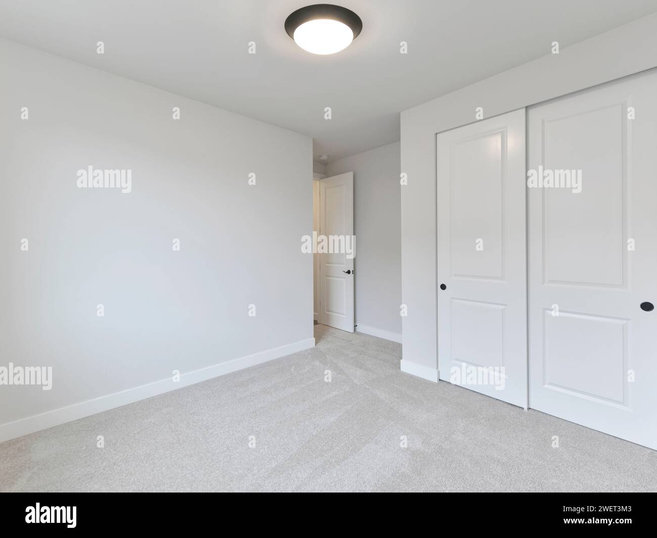 Modern residential empty bedroom interior Stock Photo - Alamy