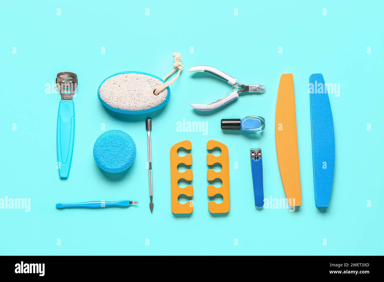 Set of professional tools for pedicure with nail polish on blue ...