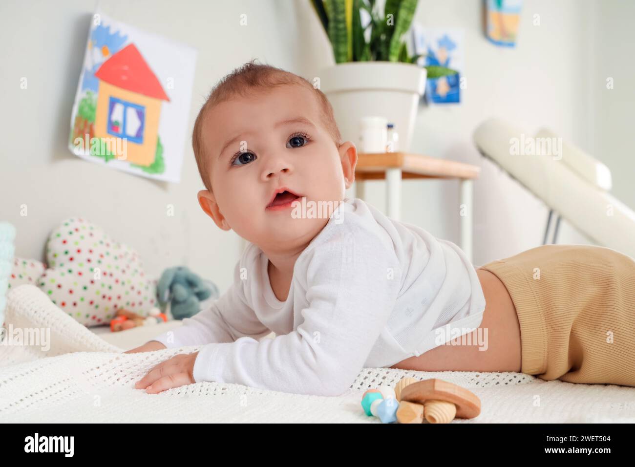 Little baby lying on table in clinic Stock Photo - Alamy