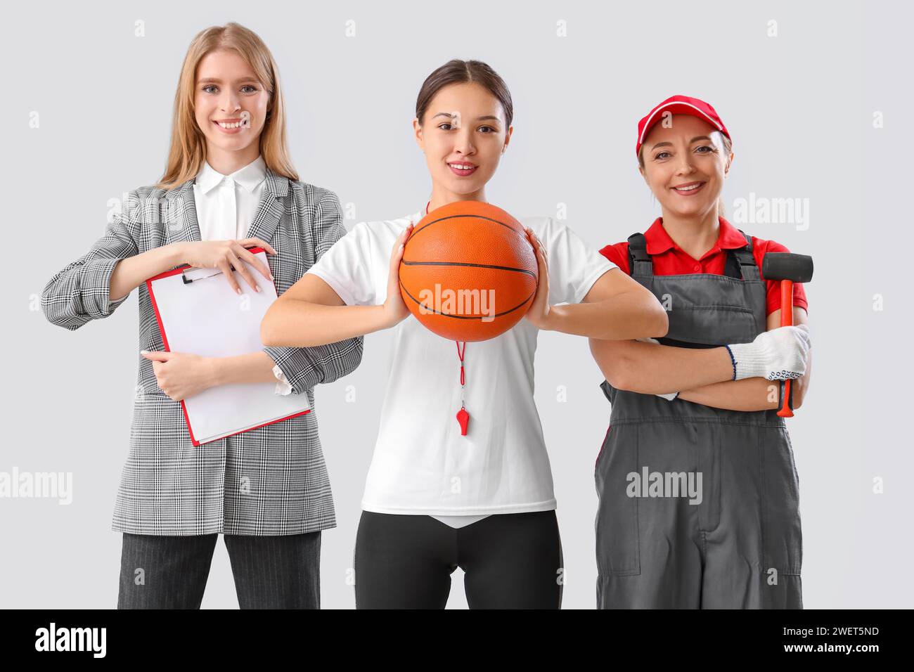 Women of different professions on grey background Stock Photo - Alamy