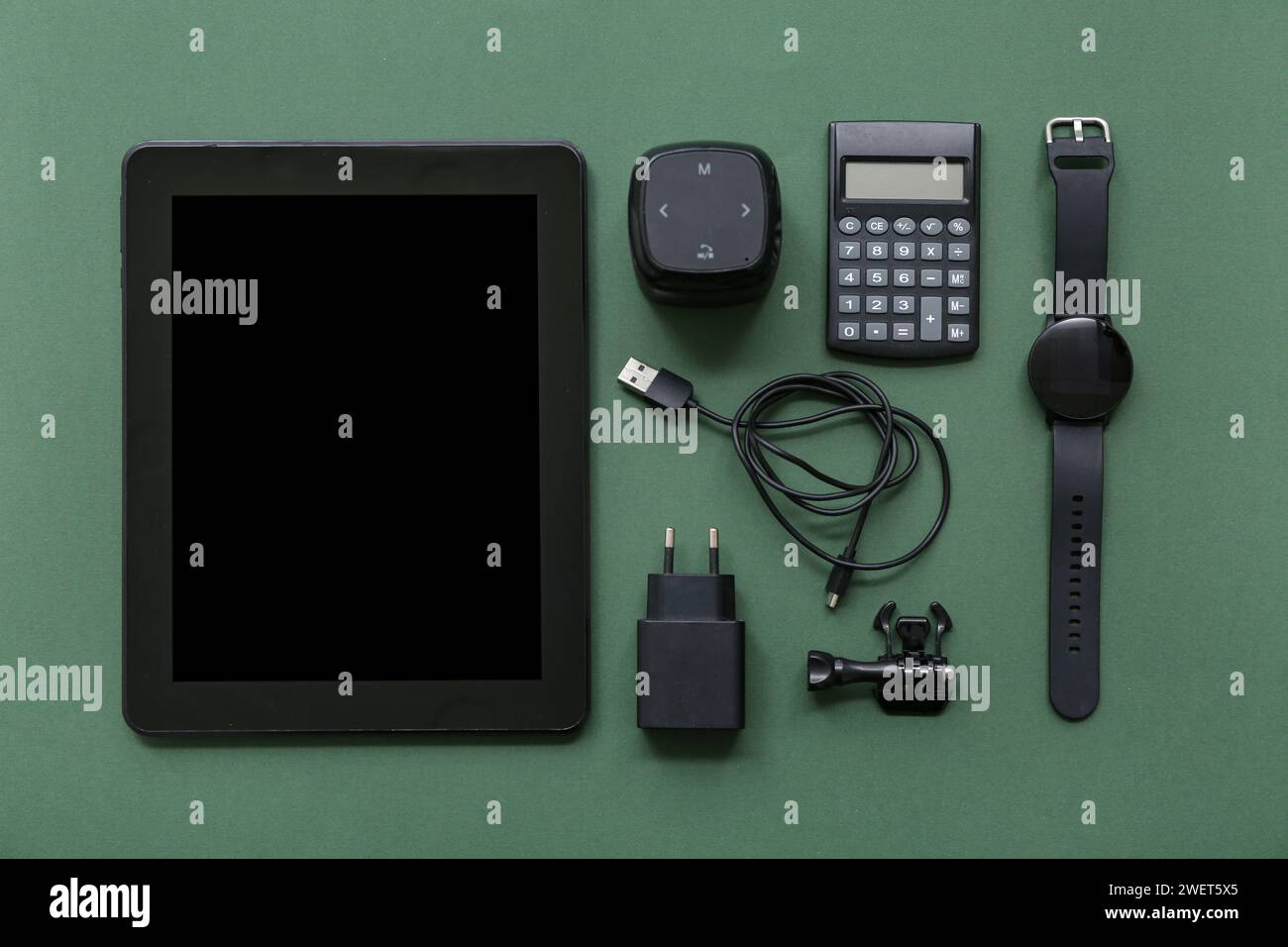 Composition with modern gadgets on green background Stock Photo - Alamy