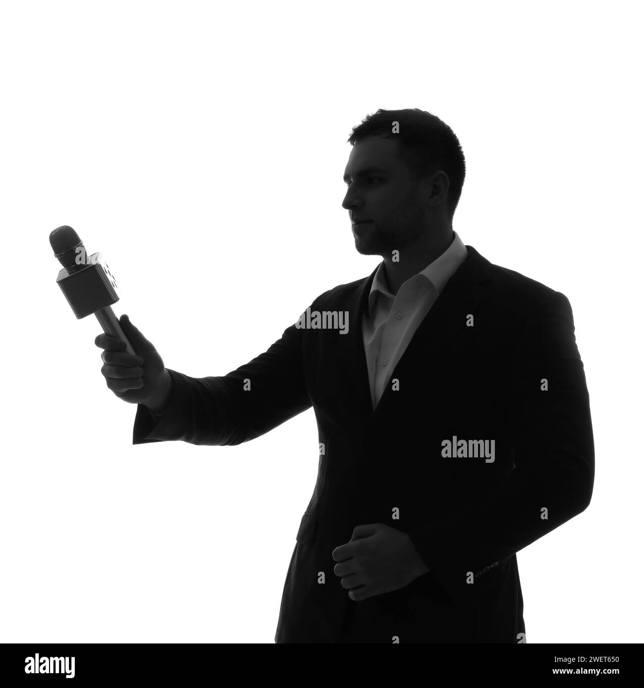 Silhouette of male journalist with microphone on white background Stock Photo - Alamy