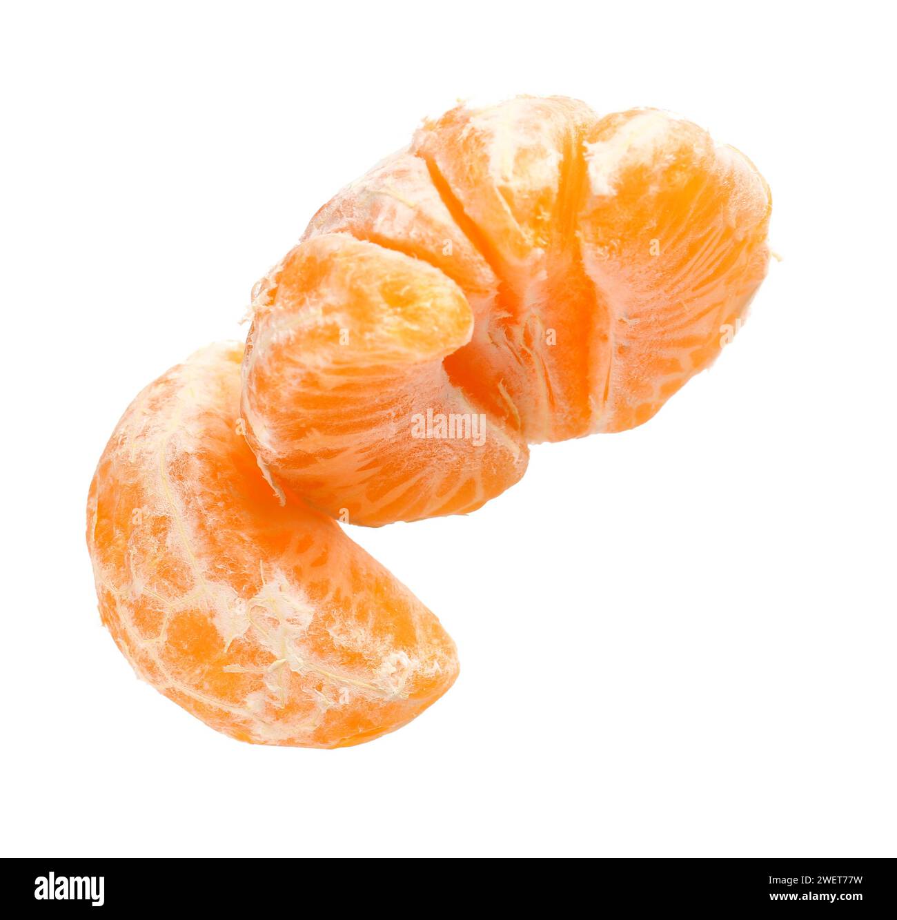 Flying segments of fresh tangerine on white background Stock Photo - Alamy