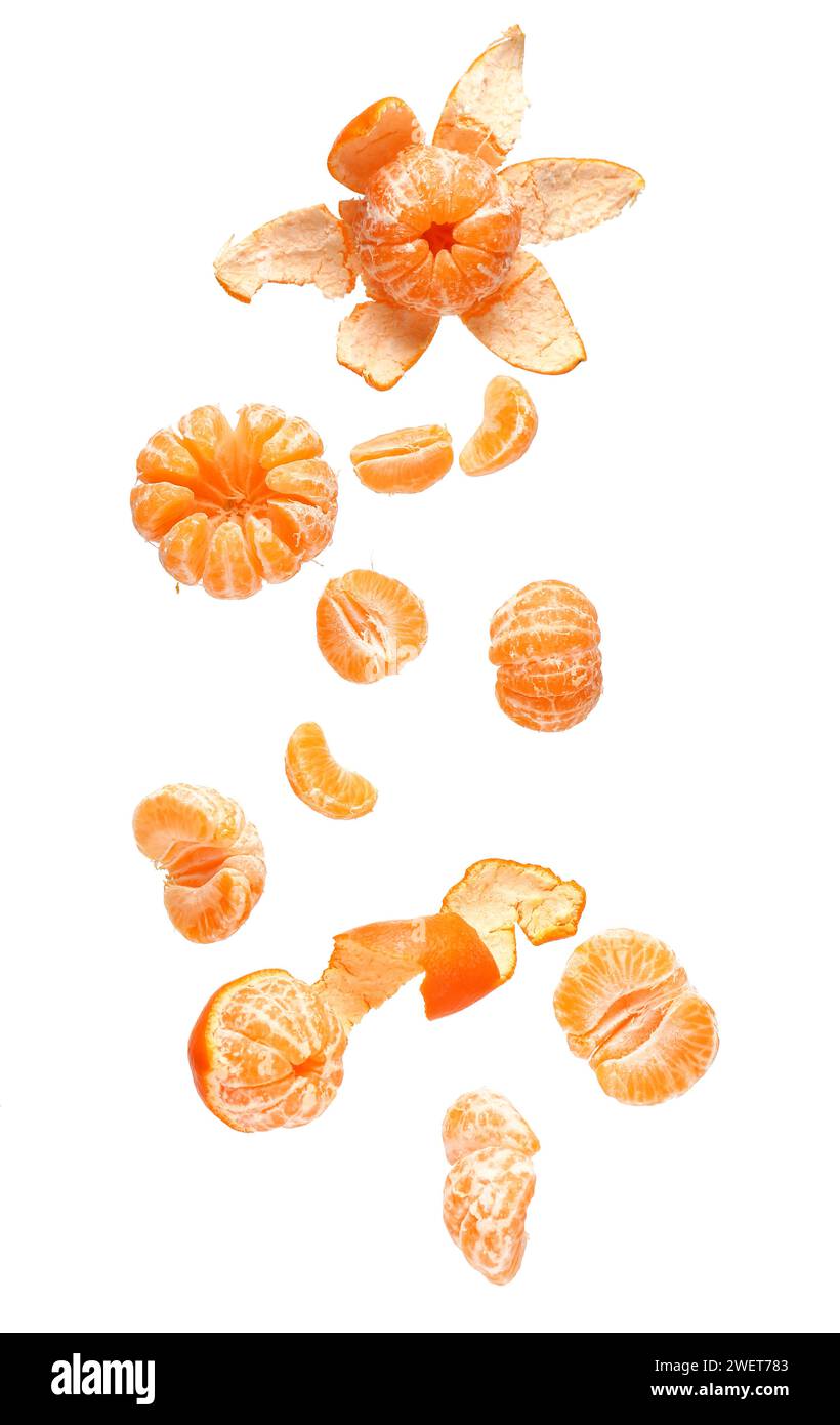 Flying fresh tangerines on white background Stock Photo - Alamy