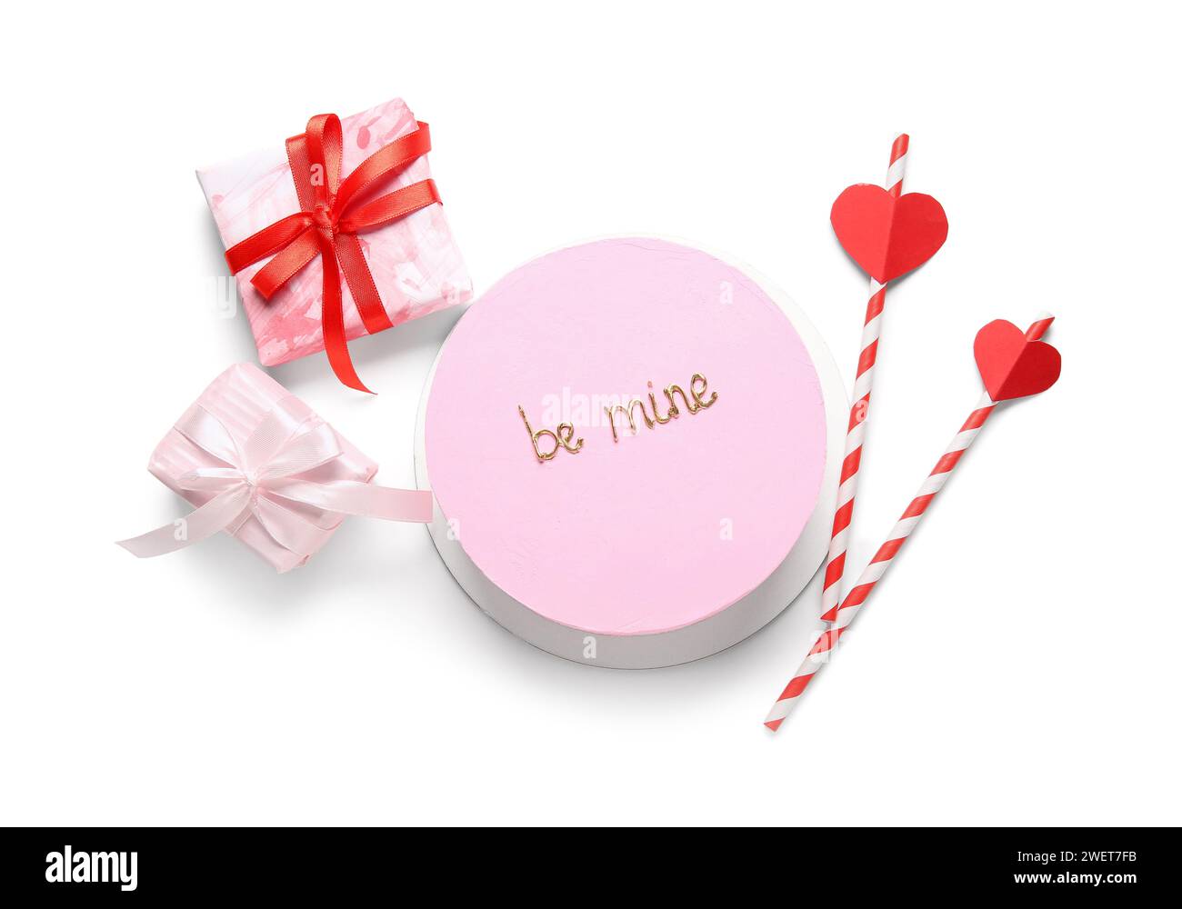 Pink bento cake with gift boxes and straws on white background ...