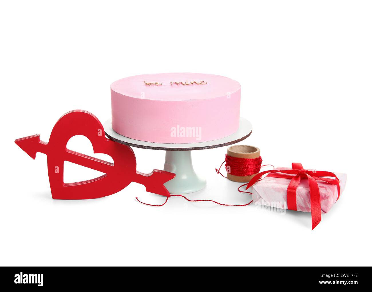 Pink bento cake with gift box and decorative heart on white background ...