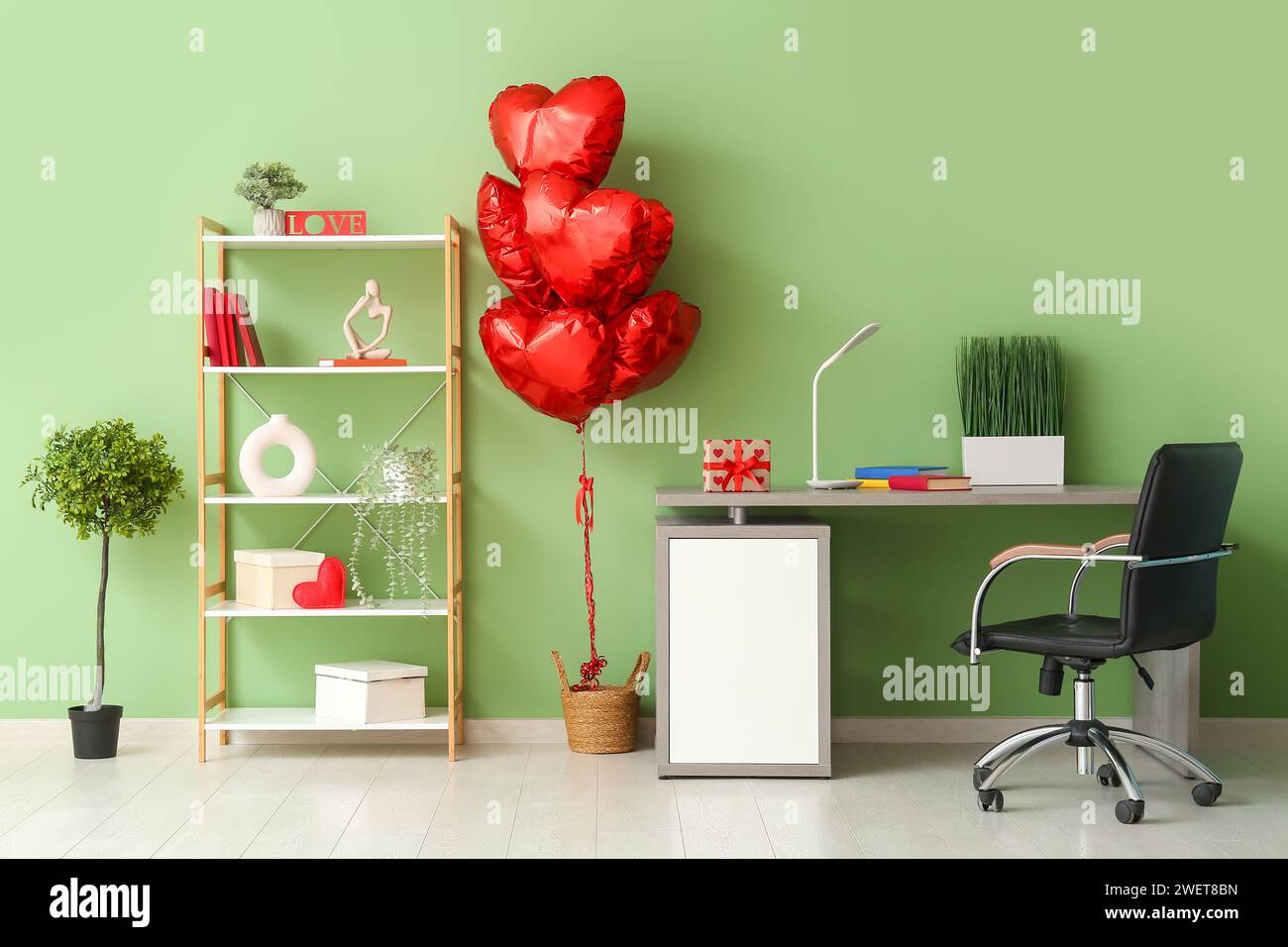 Interior of modern home office with heart-shaped balloons, Valentine's ...