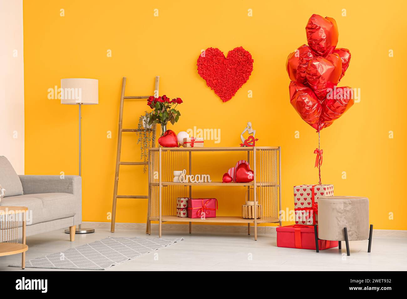 Interior of festive living room with wooden shelving unit and ...
