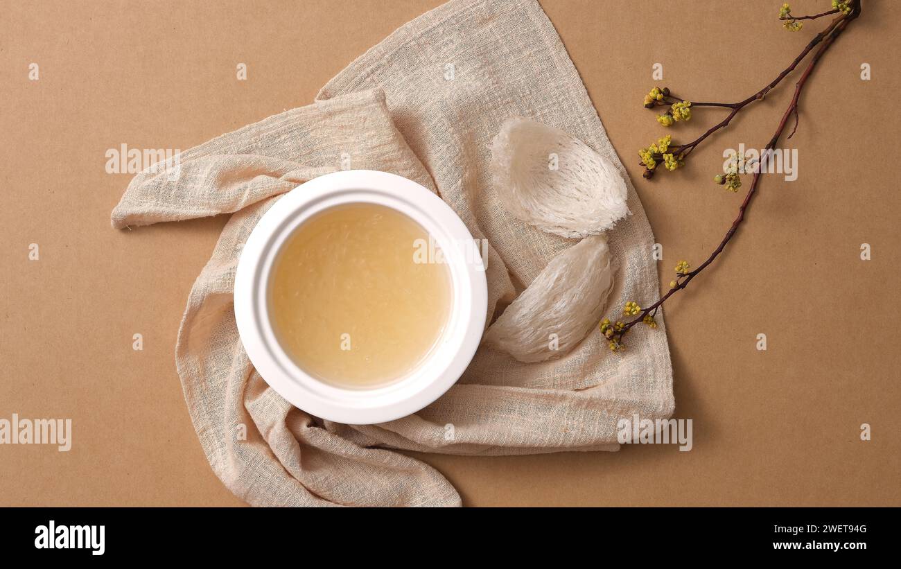 Top view of Edible bird's nest raw and soup, white handkerchief and ...