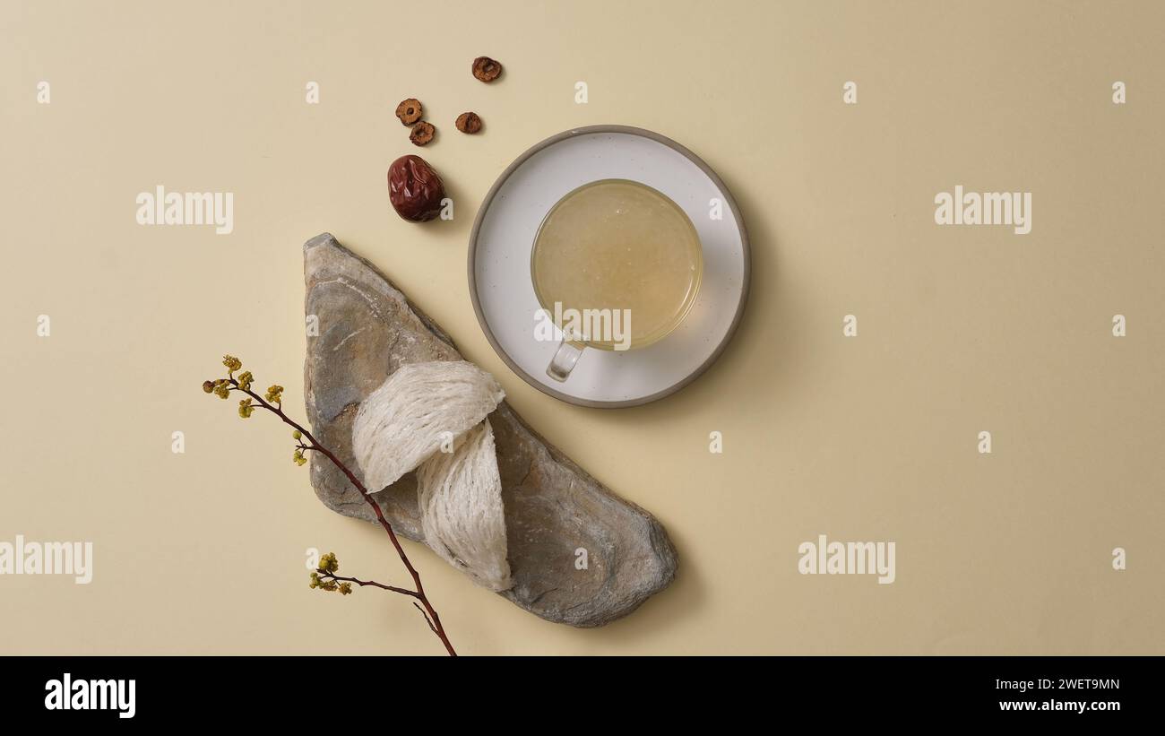 Raw bird’s nest on stone, bird’s soup and jujube on beige background ...
