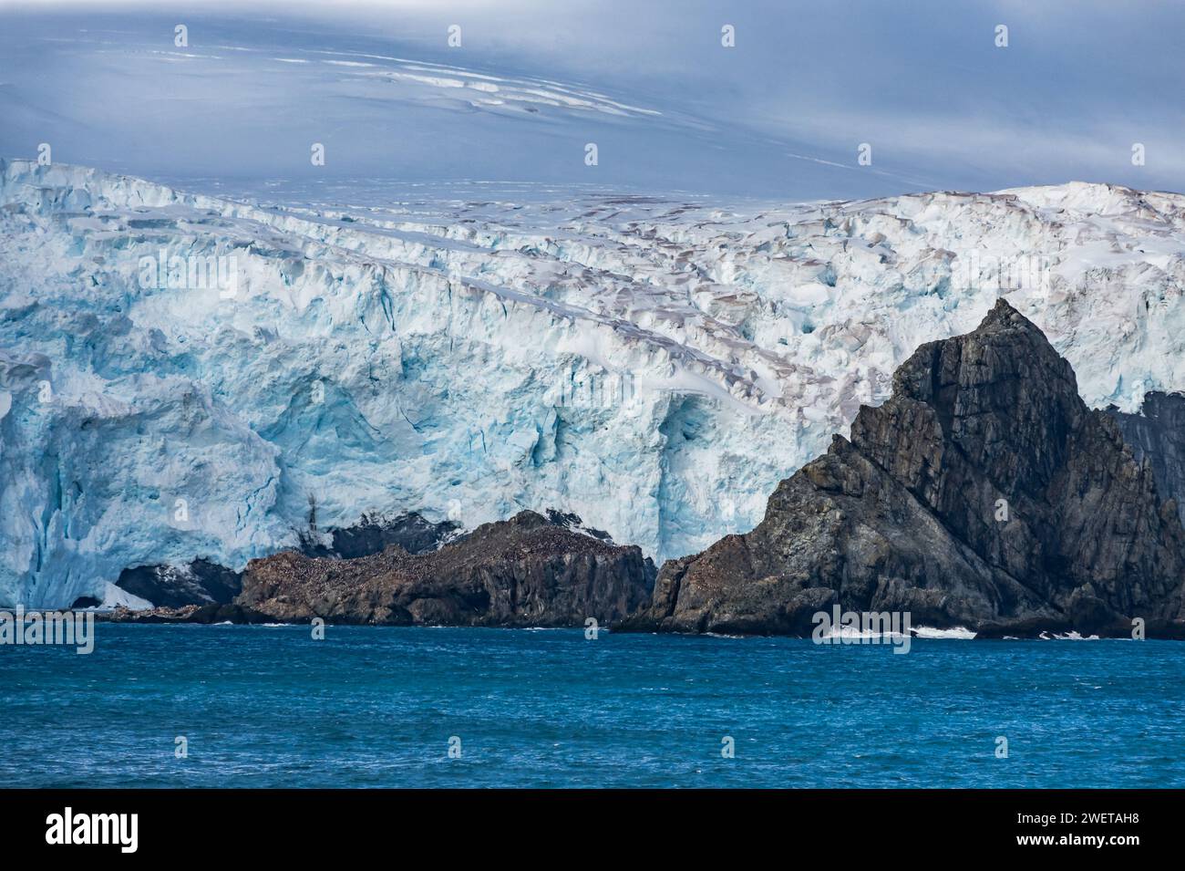 Mountains and glaciers along the coast of the Elephant Island ...
